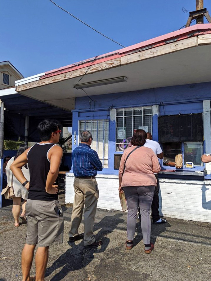 "The line forms here for happiness! This little window is where dreams come true, one to-go box at a time."