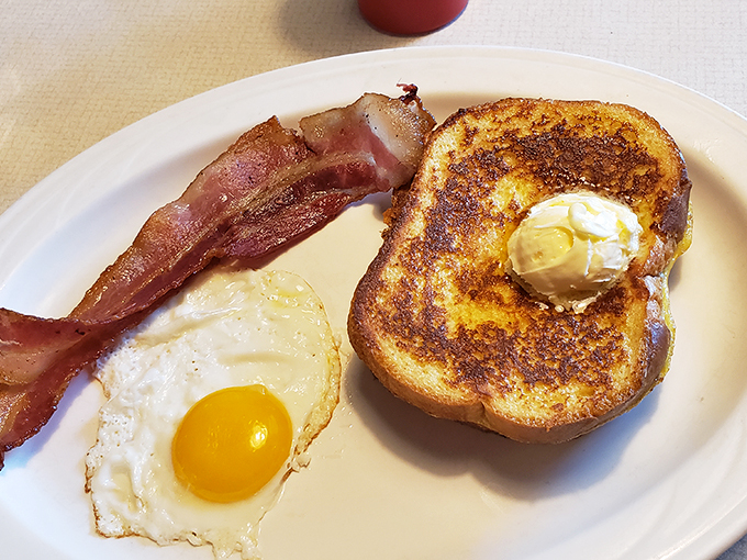 The holy trinity of breakfast: bacon, eggs, and toast. A plate so classic, it could run for office on a platform of deliciousness.