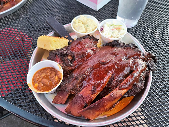These ribs aren't just fall-off-the-bone, they're practically jumping into your mouth. Slathered in sauce and glistening with flavor, they're a carnivore's dream come true.