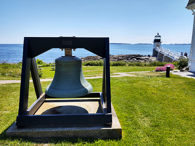 Ring my bell! This historic lighthouse bell stands ready to greet visitors with a touch of maritime nostalgia.