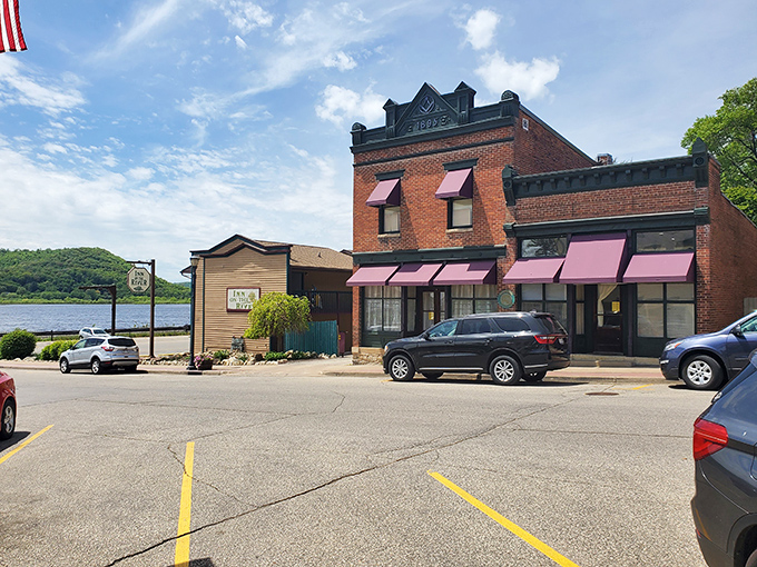 Brick, charm, and a dash of Americana. This streetscape is like a time capsule of small-town USA, complete with patriotic flair and flower baskets that would make Martha Stewart swoon.