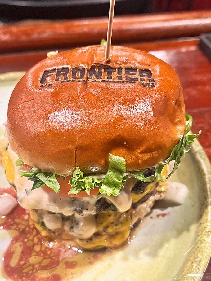 Hold onto your hats, folks! This burger's stacked higher than a cowboy's tall tale, and twice as satisfying.