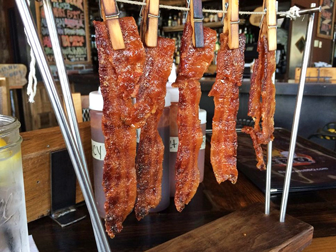 Bacon on a clothesline? It's not laundry day, it's flavor o'clock! These crispy strips are ready to be plucked and devoured like meaty wind chimes.