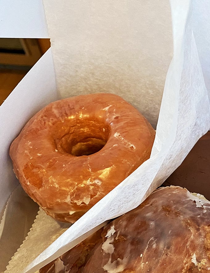 The holy grail of breakfast pastries! This classic glazed donut is so fresh, it's practically winking at you through the box.