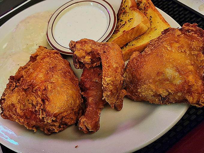 Golden, crispy, and juicier than the latest small-town gossip. This fried chicken is what dreams are made of, folks.