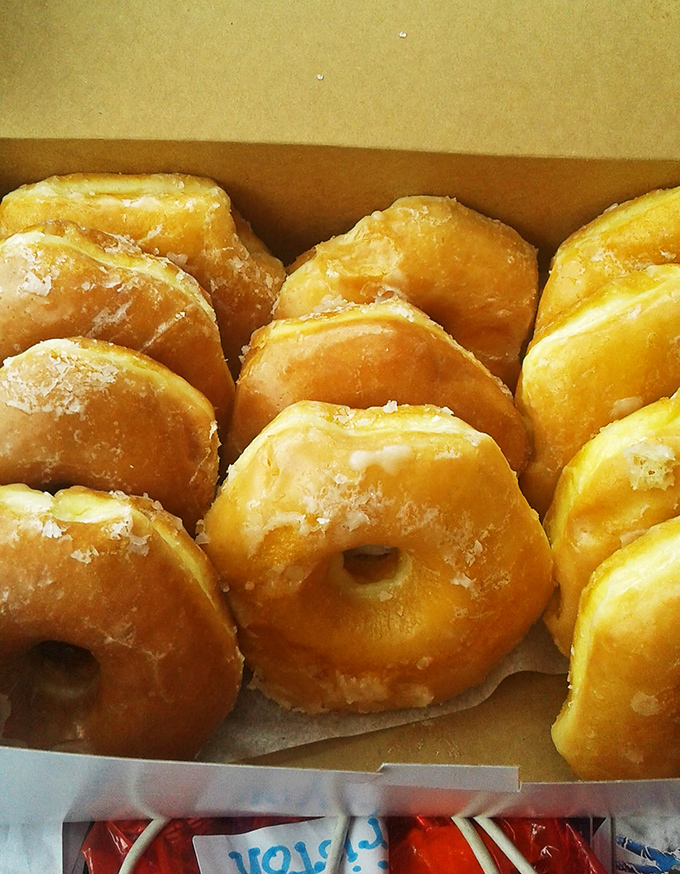 Golden halos of happiness! These glazed donuts shine brighter than any celebrity's smile on the red carpet.