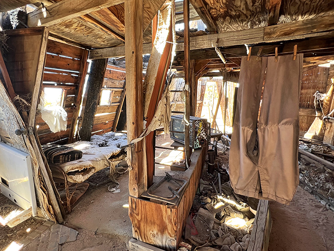 Step inside, where chaos meets creativity! This jumbled interior could be the lovechild of a yard sale and an art gallery.