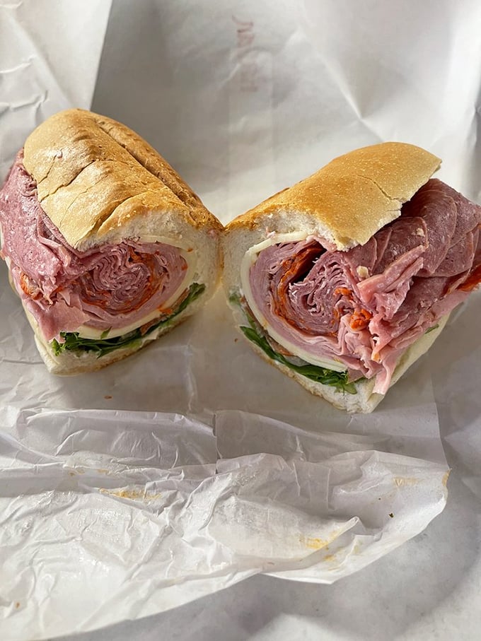 Sandwich goals, anyone? This Italian sub is stacked higher than a Jenga tower, ready to topple into your eager hands.