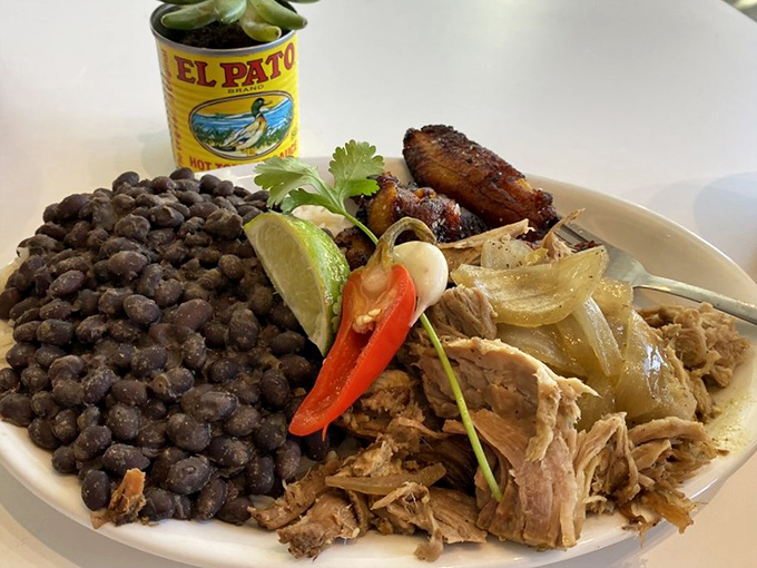 Lechon plate? More like heaven plate! This spread is so colorful, it could double as a Cuban flag made of deliciousness.