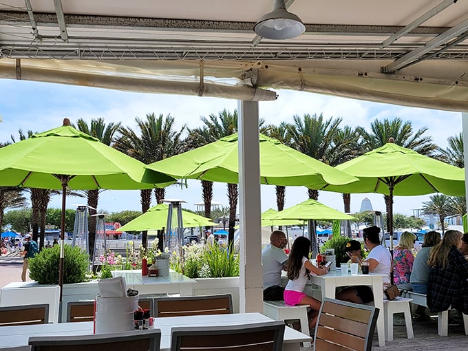 Alfresco dining at its finest! With palm trees swaying and umbrellas shading, it's like your backyard barbecue got a glamorous makeover.