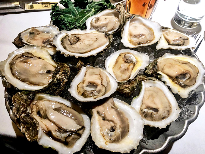 Oysters on ice, a pearl-studded ocean's delight. These briny beauties are like nature's shot glasses, best enjoyed with a splash of mignonette and a dash of daring.