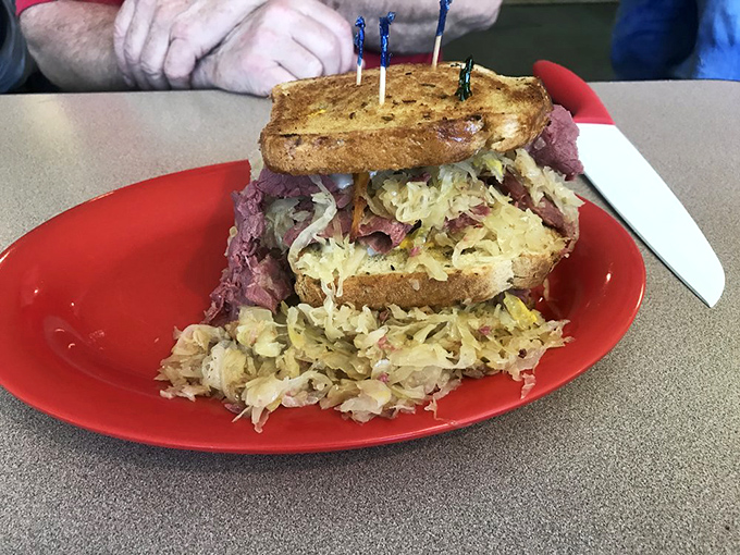 The Reuben that ate Manhattan! This towering sandwich is a skyscraper of flavor that'll have you planning your next visit.