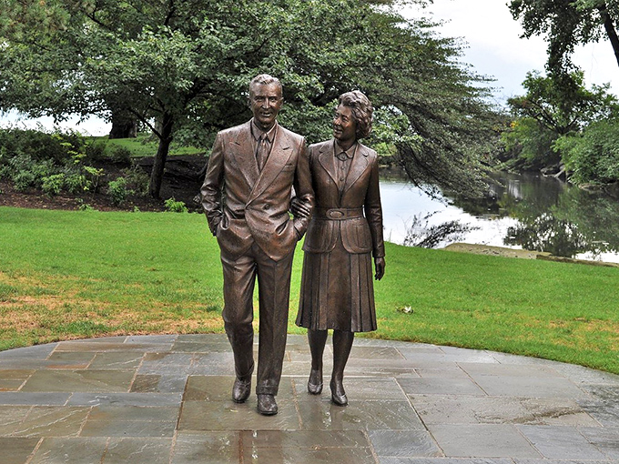 Edsel and Eleanor, frozen in bronze, eternally strolling by the lake. I wonder if they're discussing the latest Model T upgrades or planning their next soirée.