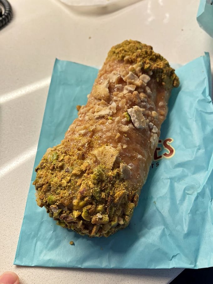 Talk about a sugar rush! This donut looks like it raided Willy Wonka's secret stash &ndash; a kaleidoscope of sweetness in every bite.