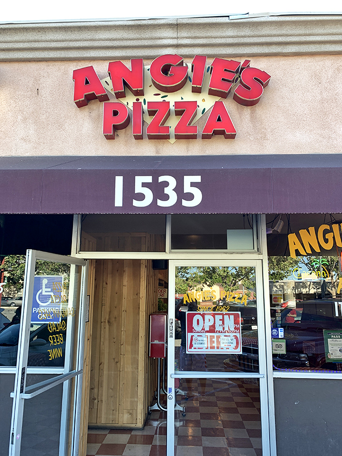 Angie's Pizza: Where 'Open' is the most beautiful word in the English language. The neon glow promises cheesy delights within.