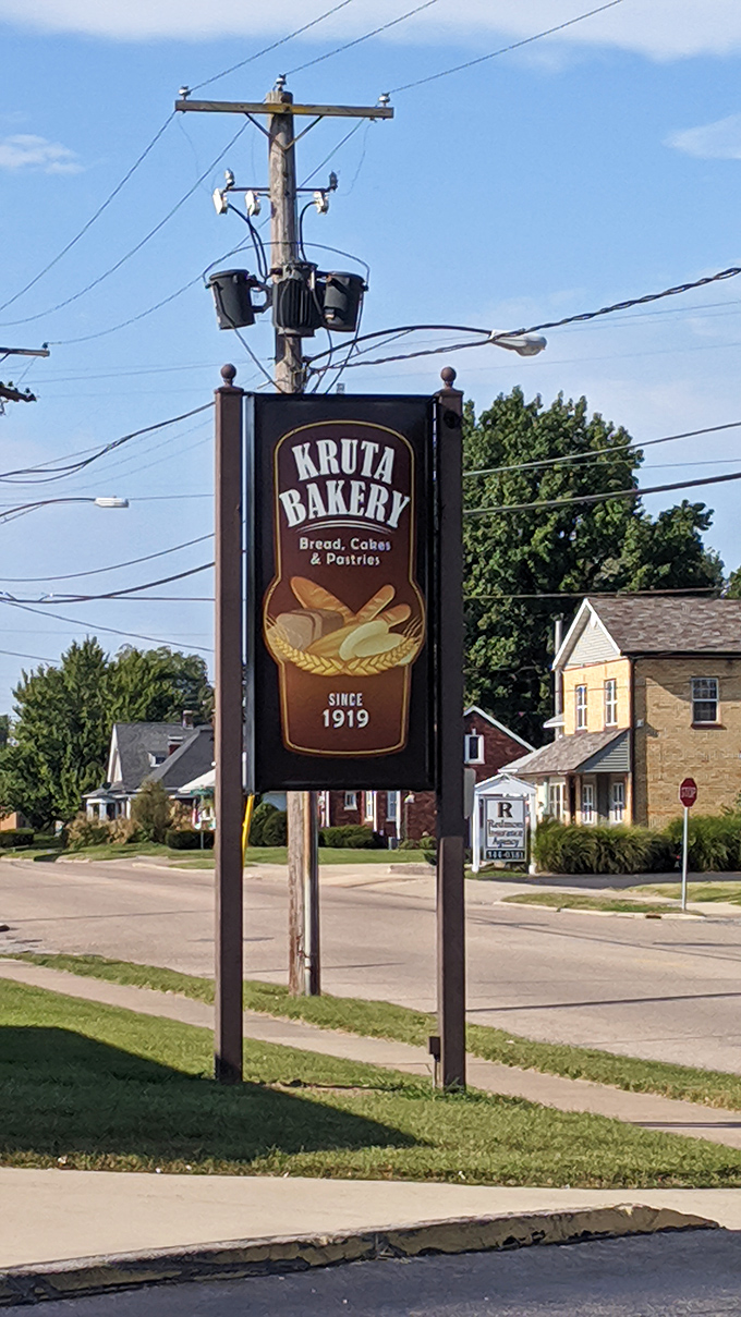 Kruta Bakery: Where history and pastry collide! This sign is like a bat signal for dessert lovers.
