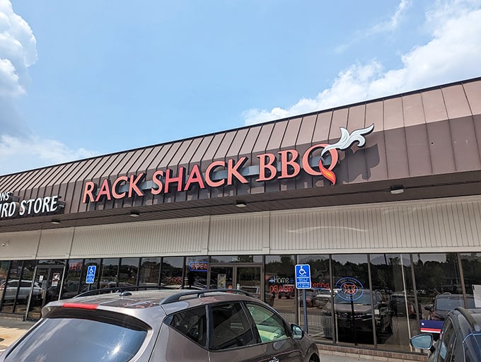 Rack Shack by day: unassuming strip mall tenant. Rack Shack by night: a neon-lit temple of tantalizing barbecue. Clark Kent, meet your meaty match.