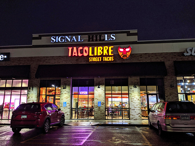 Bright lights, big flavors! Taco Libre's glowing sign is like a beacon for taco lovers, promising a smackdown of deliciousness inside.