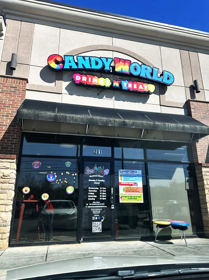 Sugar rush central! Candy World's vibrant storefront is like a beacon for sweet tooths, promising a kaleidoscope of cavity-inducing joy inside.