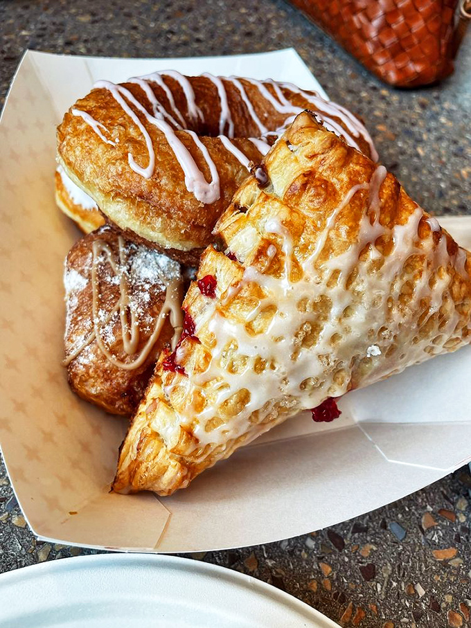 Sweet tooth paradise! Roy's pastry case is like a treasure chest of sugary gold. Resistance is futile, so grab a napkin and dive in!