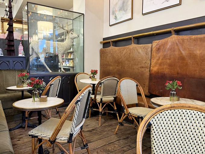 Parisian caf&eacute; vibes with a side of Southern hospitality. Is that a stuffed deer I spy? Talk about a conversation starter!