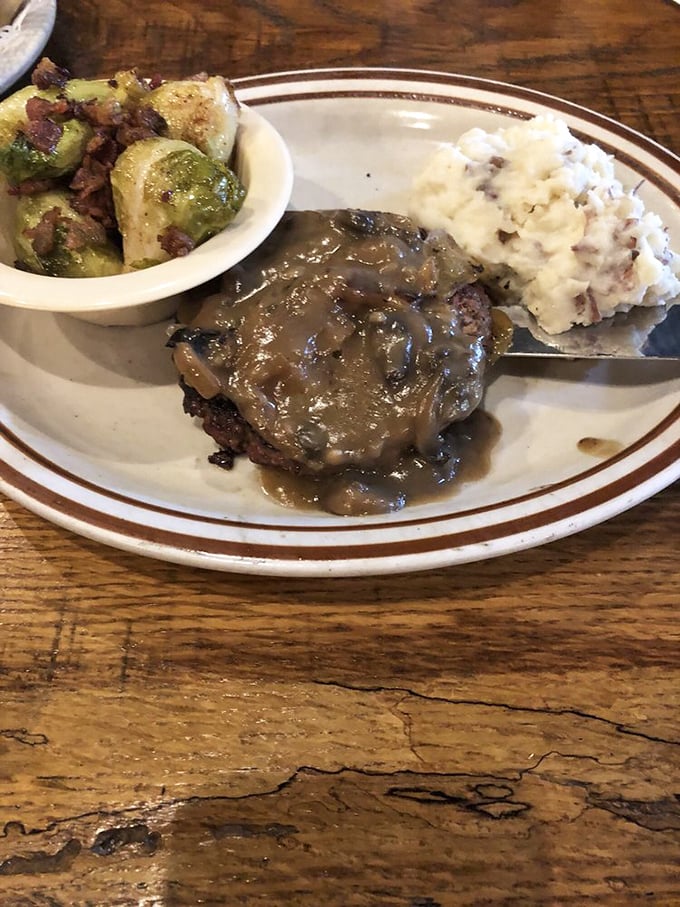 This hamburger steak isn't horsing around. It's bringing serious flavor to the table, along with its veggie sidekicks.