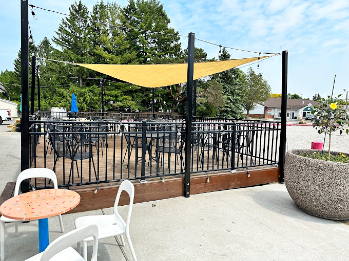 Al fresco dining with a side of sunshine! This charming patio is the perfect spot for people-watching and coffee-sipping.