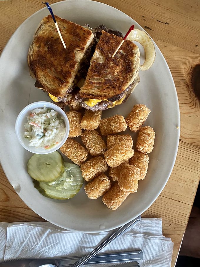 The ultimate diner trifecta: crispy toast, gooey cheese, and a burger patty. It's like the holy grail of comfort food, but you can actually eat it.