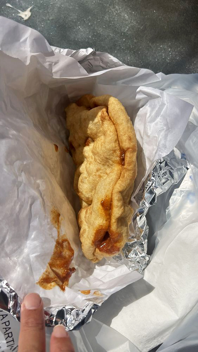 Red chili fry bread: Where comfort food meets a spicy kick. It's like a warm hug for your mouth.