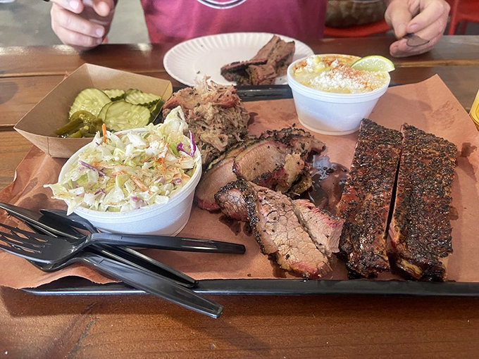 A barbecue platter that's more colorful than a Pixar movie. Who knew veggies could look so good next to all that glorious meat?