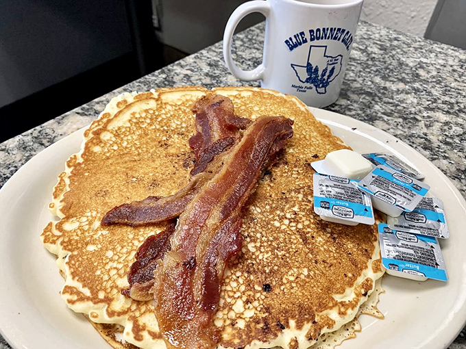Pancakes so fluffy, they might float away if not anchored down by crispy bacon. It's breakfast's answer to cloud nine.