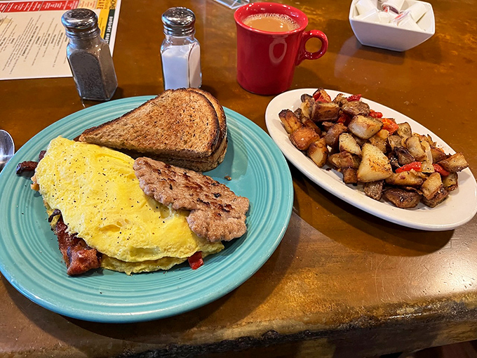 A breakfast spread that would make Ron Swanson proud. Eggs, bacon, and potatoes - the holy trinity of morning indulgence.