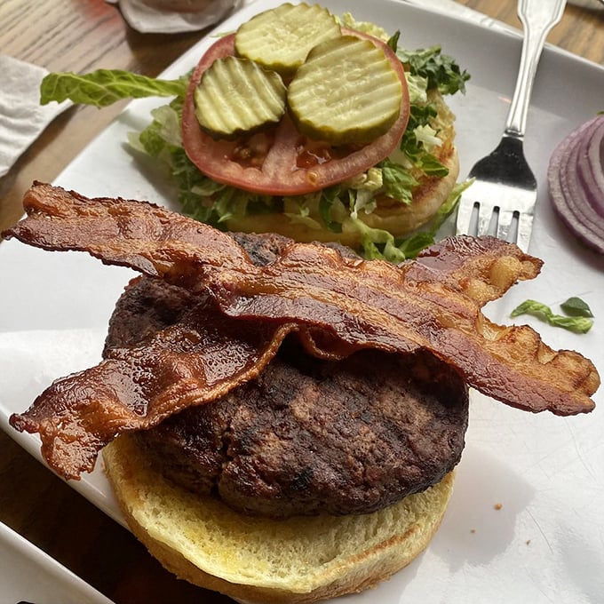 Hold the cheese, bring the flavor! This burger's stacked higher than a pilot's logbook, ready for taste buds to take flight.