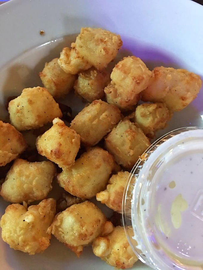 Cheese curds: Wisconsin's edible stress balls. These golden nuggets of joy squeak louder than a mouse at a cat convention!