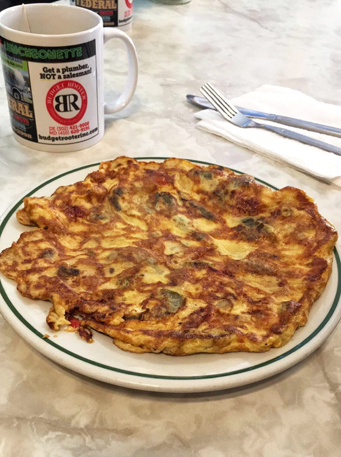 This omelet's so fluffy, it might float away if not for the generous helping of melty cheese keeping it grounded.