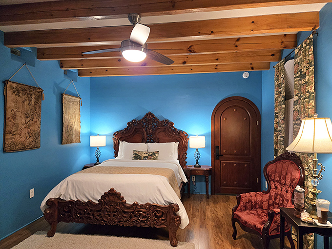 Blue walls, ornate bed, and... is that a ceiling fan? This duke's chamber is the perfect mix of medieval luxury and Southern comfort.
