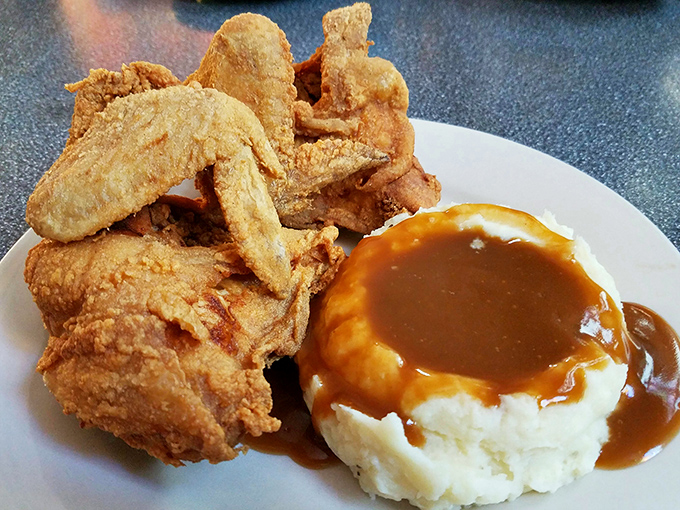 Golden-brown perfection meets cloud-like mashed potatoes. It's a plate that would make Colonel Sanders weep with envy.