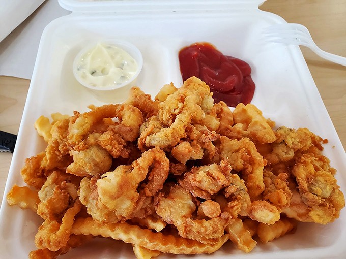 Golden treasures from the sea. These fried clams are like edible pearls, each bite a briny burst of New England charm.