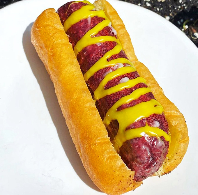 Hot diggity donut! This creative concoction proves that sometimes, thinking outside the box means putting a sausage inside a long john.