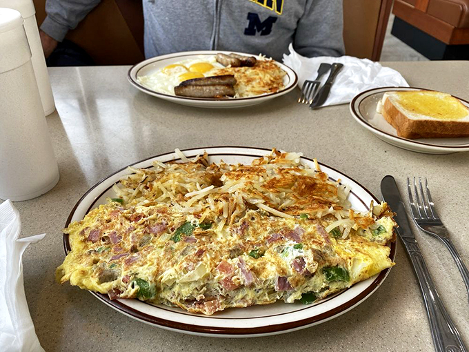 The Kitchen Sink Omelet: Where "everything but the kitchen sink" becomes a delicious reality on your plate.
