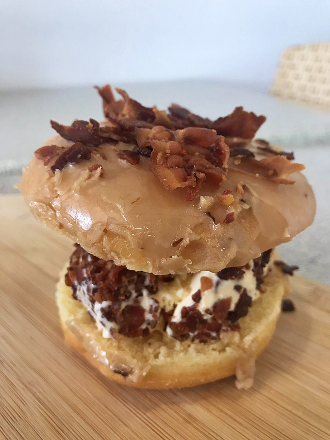 The maple bacon donut: where breakfast meets dessert in perfect harmony. It's like your taste buds are doing the cha-cha.