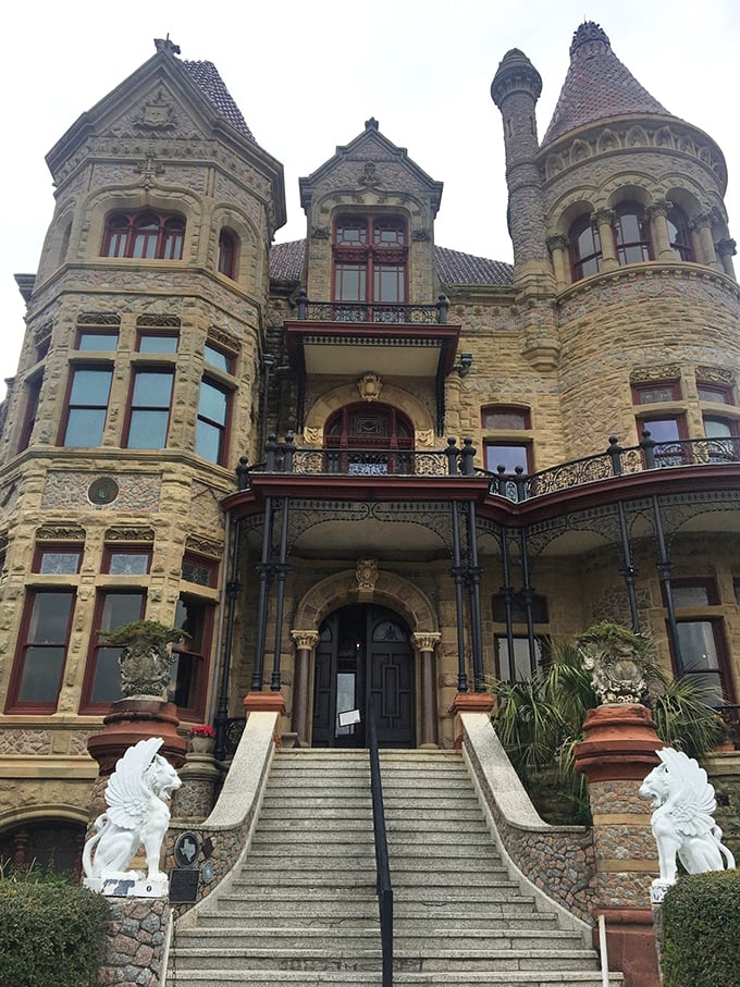 "Stairway to heaven or gateway to history?" White statues guard the entrance, beckoning visitors to ascend into a world of Victorian splendor.