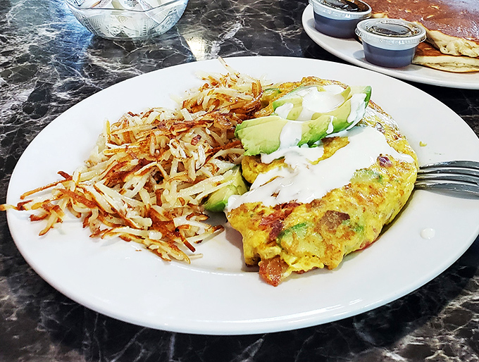 Avocado and bacon: the dynamic duo of breakfast! This omelet is so good, it might make you forget about your morning coffee. Almost.