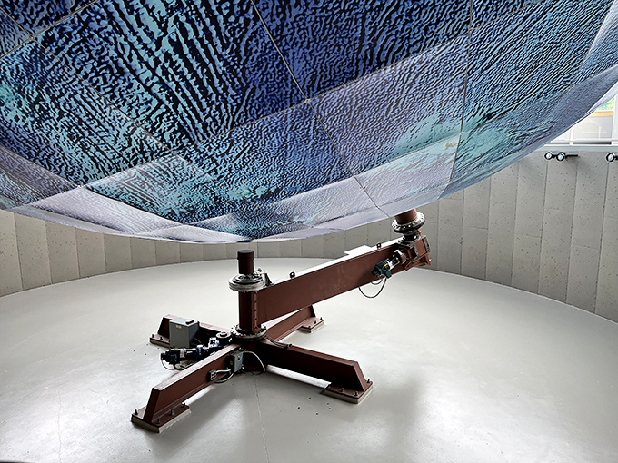 The nuts and bolts of planet Earth! Eartha's intricate base is like a mechanical ballet keeping our world spinning.