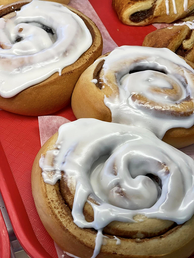 Cinnamon rolls or edible pillows? These gooey spirals of happiness look ready to comfort your taste buds into sweet submission.