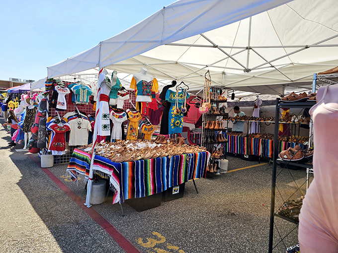 Outdoor shopping with indoor comfort! These racks are a fashionista's playground, offering everything from serapes to sundresses under the desert sky.