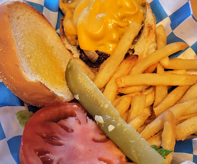 Golden fries, crispy pickles, and a burger that's ready for its close-up. This plate is the Hollywood star of comfort food!