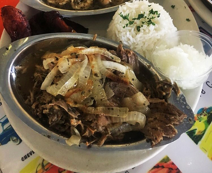 Behold, the star of the show: lechon that's more tender than a love song. It's the kind of dish that inspires poetry – or at least happy food comas.