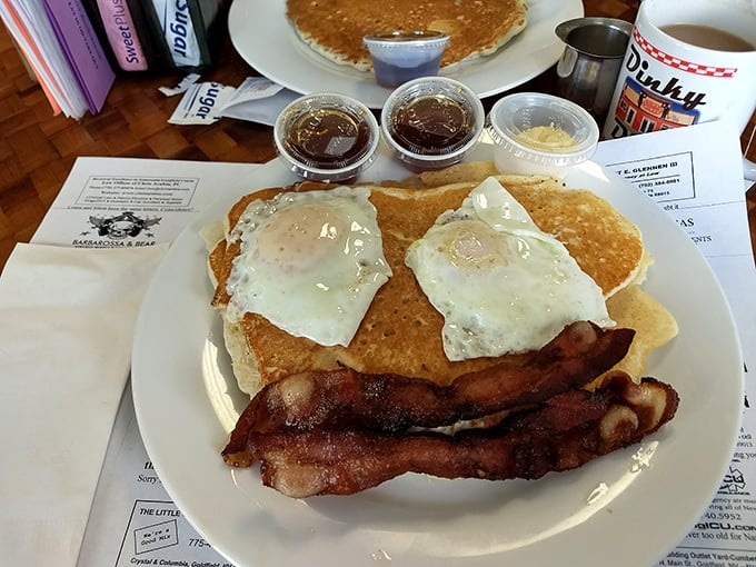 Stack attack! These golden pancakes are so fluffy, they might just float off your plate. Don't forget to dive into that river of syrup!