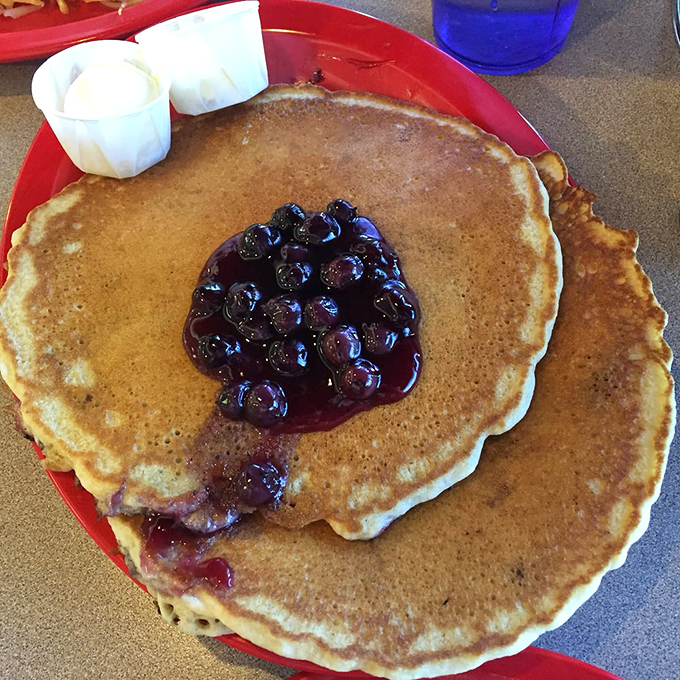Pancake perfection! These golden discs of joy are so fluffy, they might float right off your plate if not for that luscious berry topping.